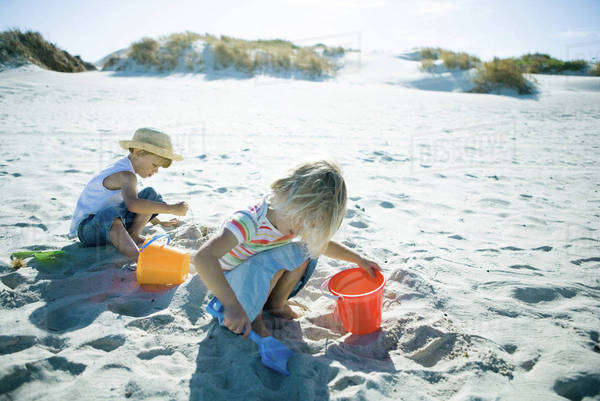 Children playing in sand - Royalty-free Stock Photo | Dissolve