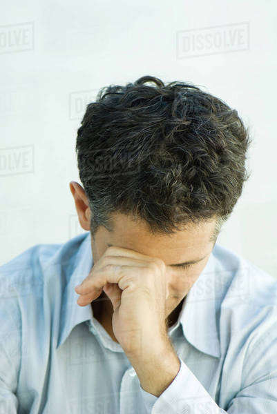 Man leaning head against fist, portrait - Royalty-free Stock Photo ...