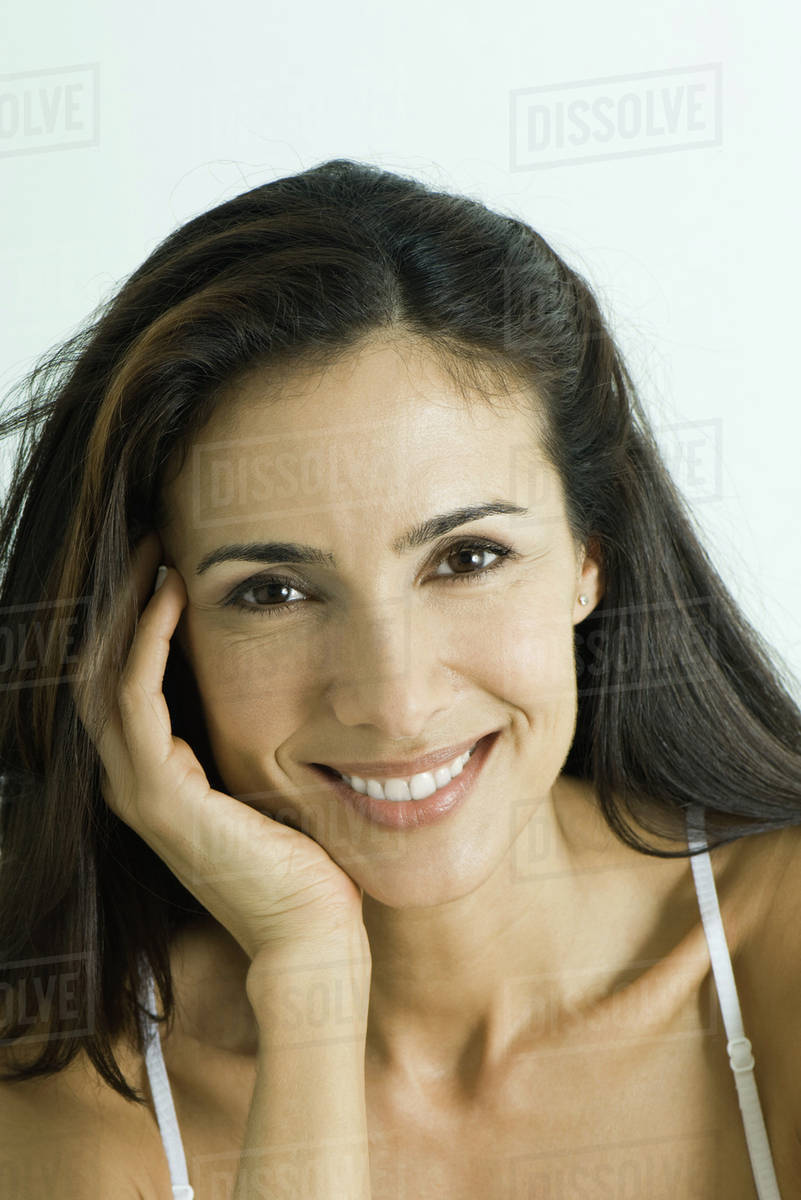 Woman leaning on hand, smiling at camera, portrait - Royalty-free Stock ...