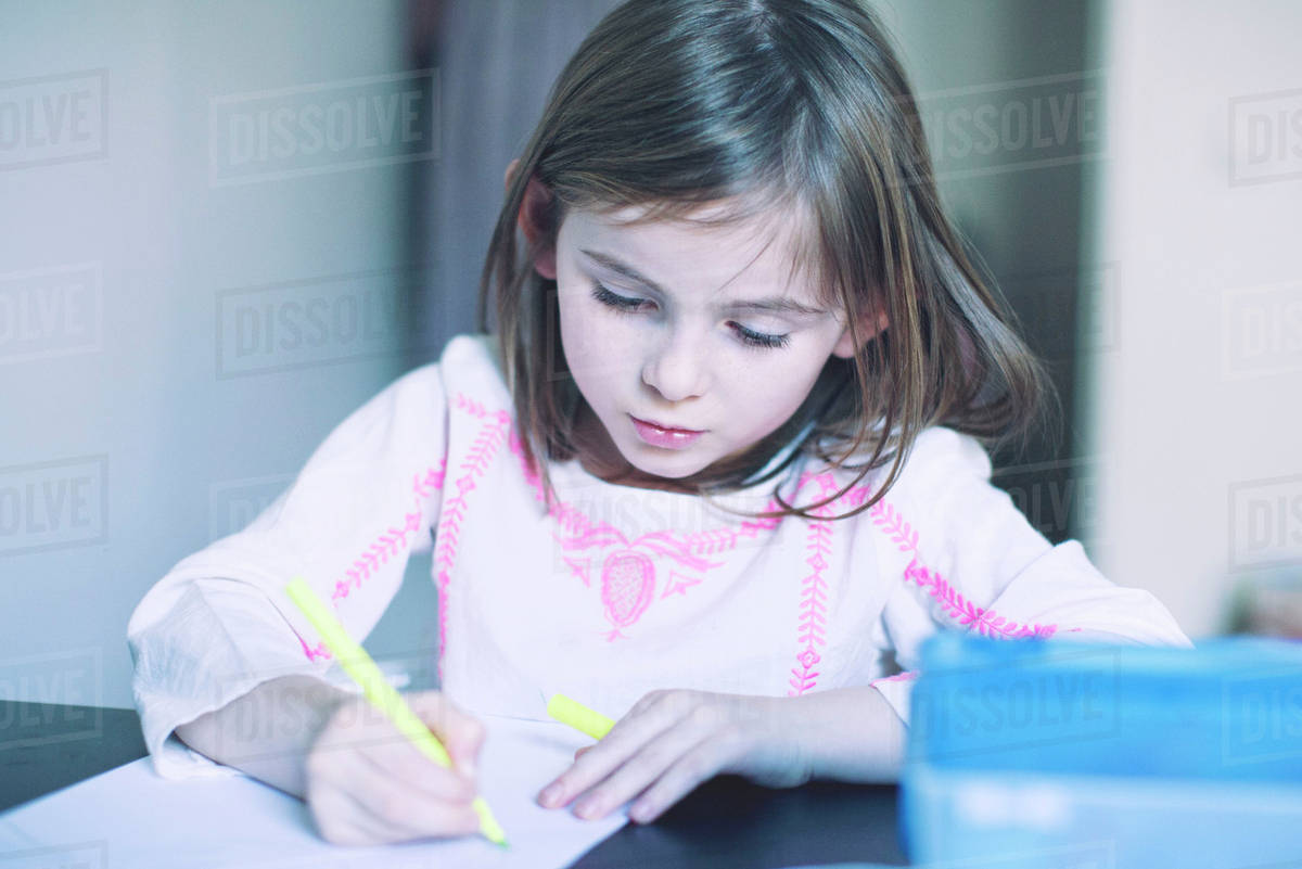 Girl drawing in notebook - Royalty-free Stock Photo | Dissolve