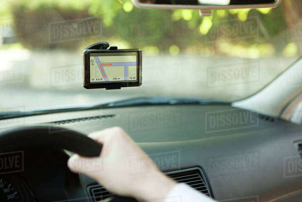 Driver using GPS unit for navigation assistance - Royalty-free Stock ...