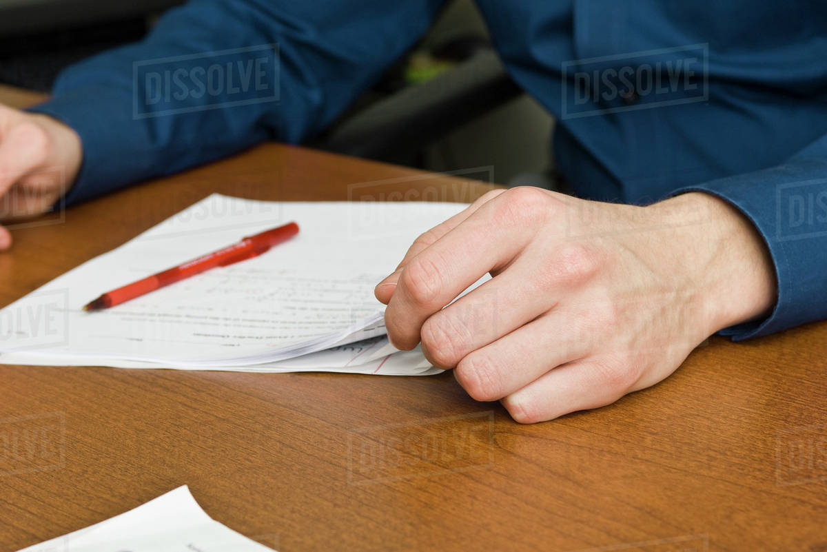 Person reading document - Stock Photo - Dissolve