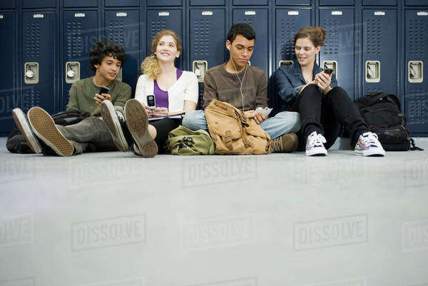 High school students hanging out in school corridor - Stock Photo ...