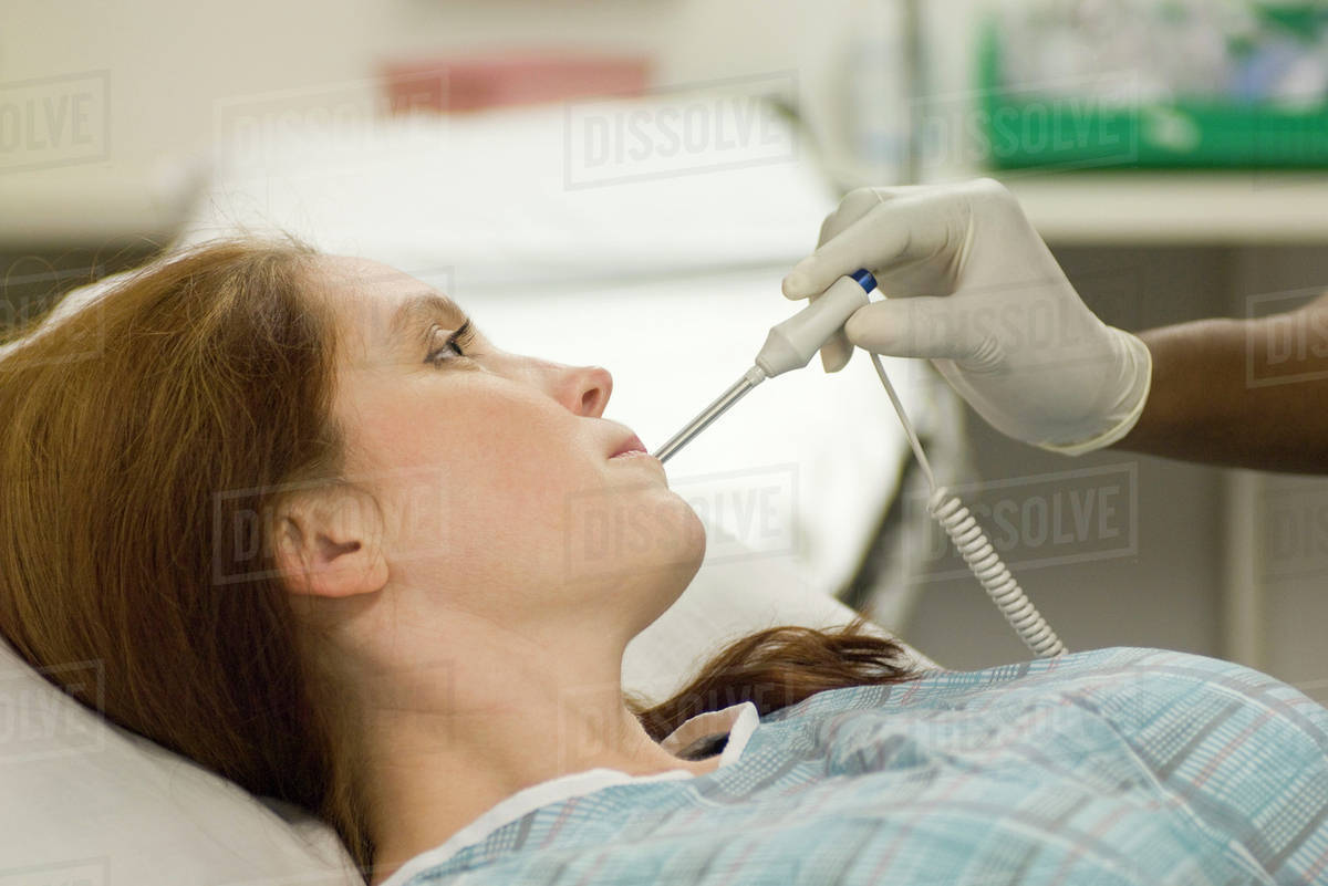 Nursing taking patient's temperature - Royalty-free Stock Photo | Dissolve