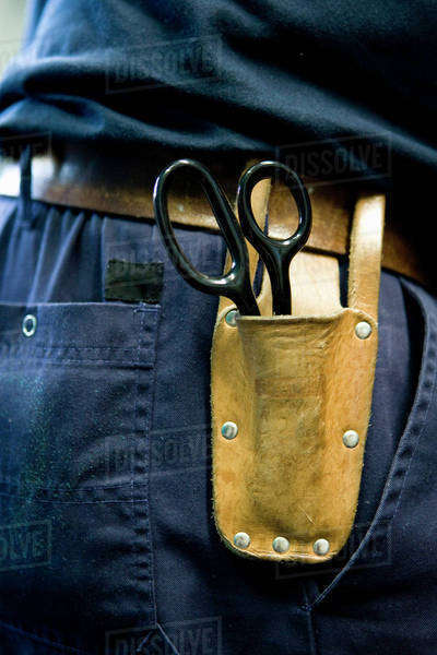 Scissors in pouch on tool belt - Royalty-free Stock Photo | Dissolve