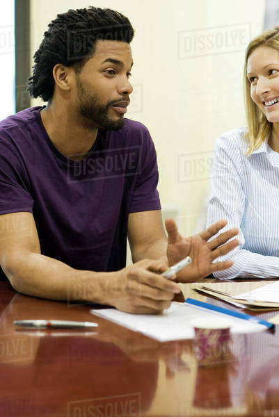 Man explaining idea to colleague in meeting - Royalty-free Stock Photo ...