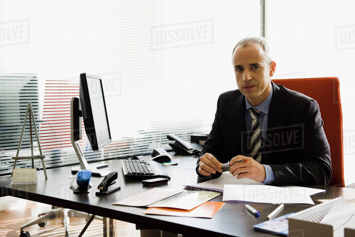 Executive in office, portrait - Royalty-free Stock Photo | Dissolve