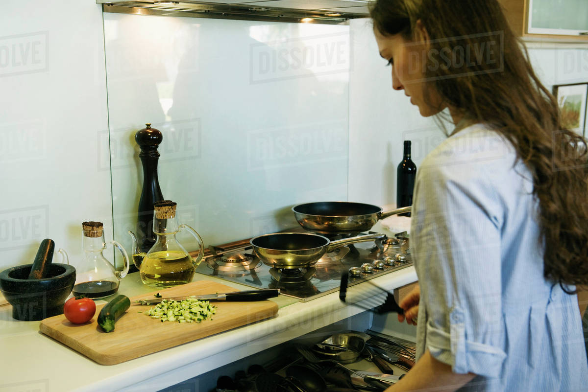 Woman cooking - Royalty-free Stock Photo | Dissolve