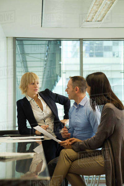 Colleagues discussing work - Royalty-free Stock Photo | Dissolve