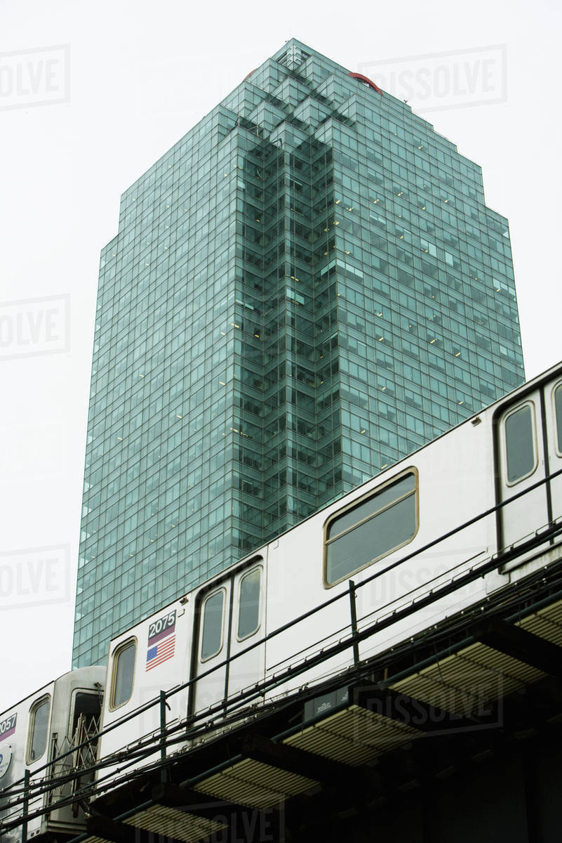 Elevated subway, office building in background, low angle view - Stock ...