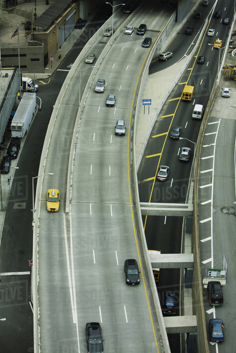 Elevated freeway, busy city streets - Royalty-free Stock Photo | Dissolve