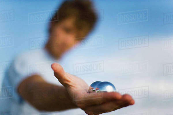 Man holding yin yang balls in hand, close-up - Royalty-free Stock Photo ...