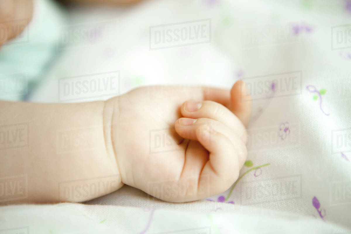 Infant's hand, close-up - Royalty-free Stock Photo | Dissolve