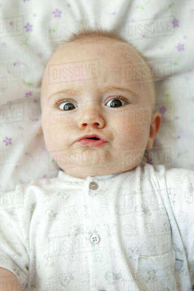 Baby making faces at camera, portrait - Royalty-free Stock Photo | Dissolve