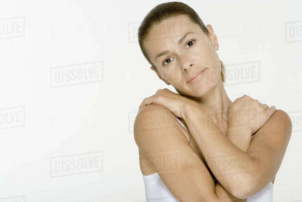 Woman folding arms across chest, looking at camera - Royalty-free Stock ...