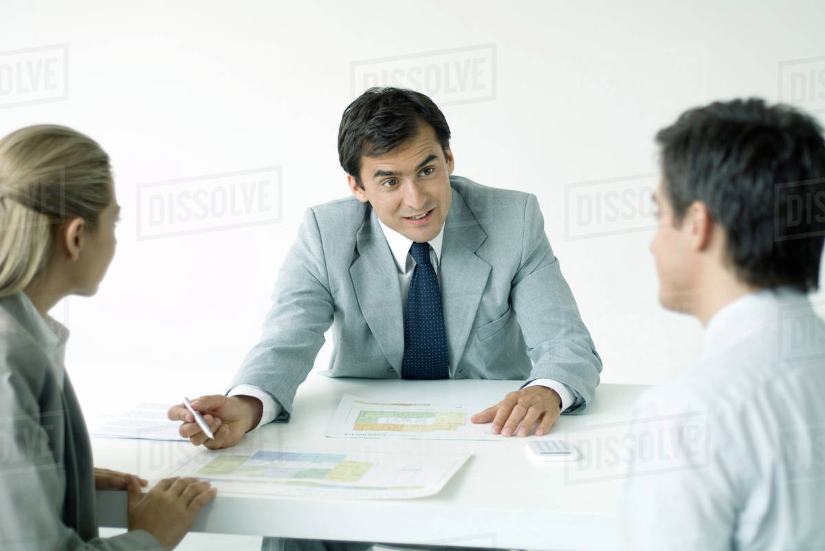 Professional explaining blueprints to clients - Royalty-free Stock ...