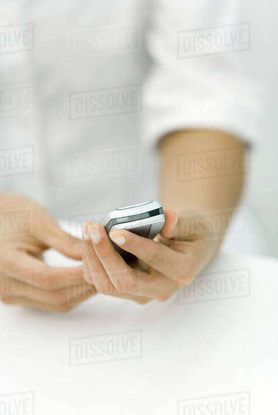 Person holding cell phone, cropped view of hands - Royalty-free Stock ...