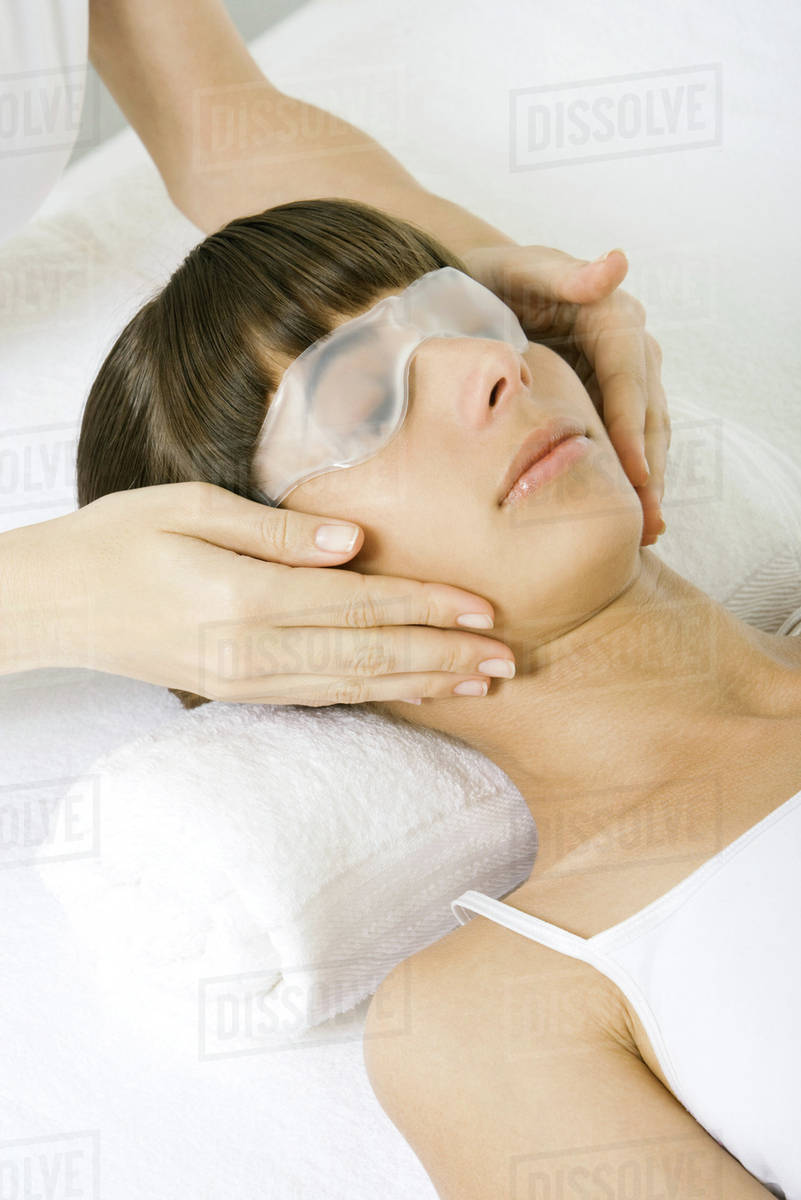 Woman wearing face mask and receiving facial - Royalty-free Stock Photo ...