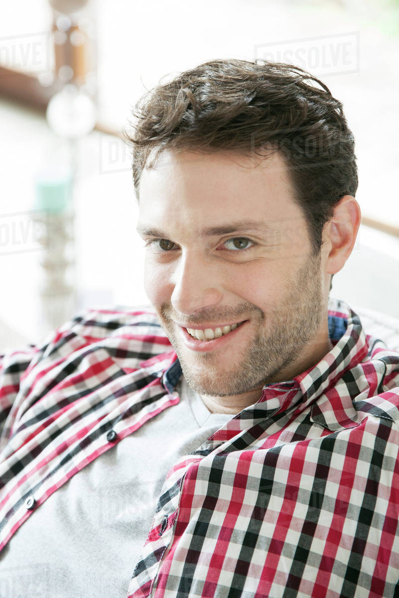 Man smiling, portrait - Royalty-free Stock Photo | Dissolve