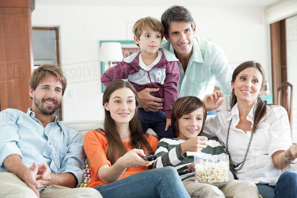 Family watching TV together - Stock Photo - Dissolve