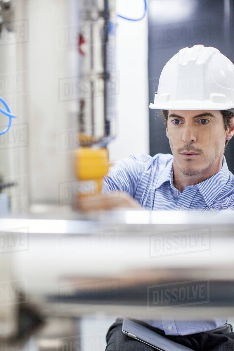 Engineer at work at industrial plant - Royalty-free Stock Photo | Dissolve