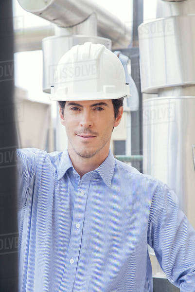 Engineer at industrial site, portrait - Royalty-free Stock Photo | Dissolve