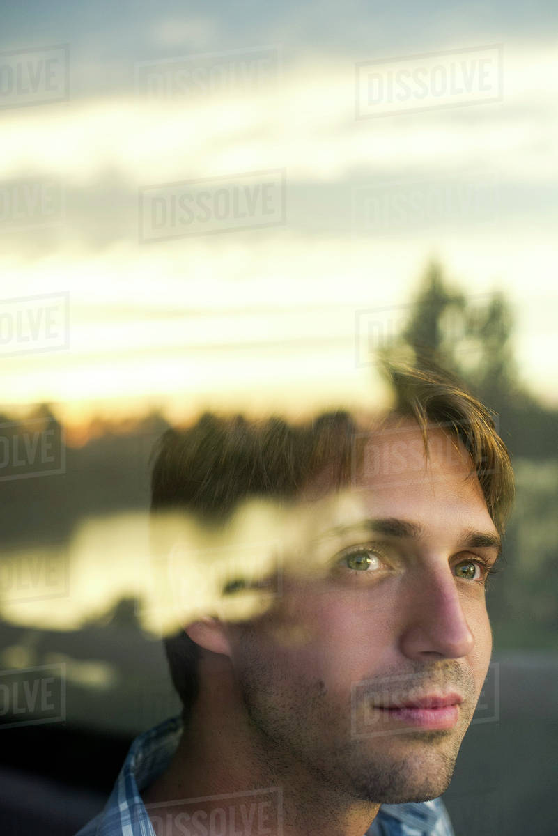 Man watching sunrise - Royalty-free Stock Photo | Dissolve