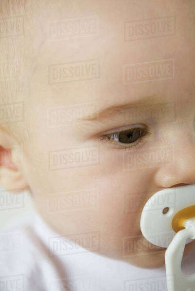 Baby with pacifier, cropped view of face - Royalty-free Stock Photo ...