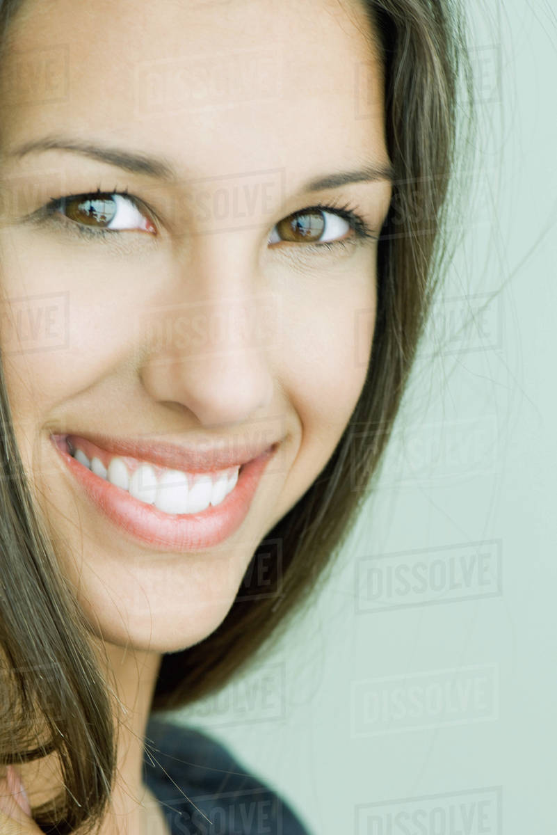 Female smiling at camera, portrait - Royalty-free Stock Photo | Dissolve