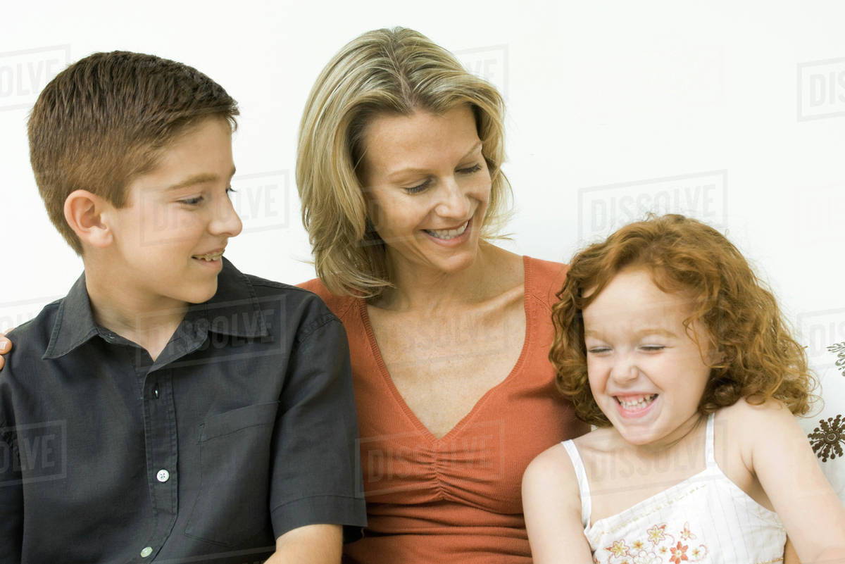 Mother and two children smiling together, close-up - Royalty-free Stock ...
