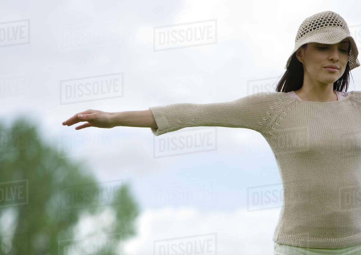 Woman standing outdoors with arms out, cropped - Royalty-free Stock ...