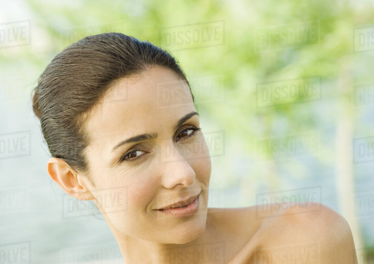Bare shouldered woman smiling - Royalty-free Stock Photo | Dissolve