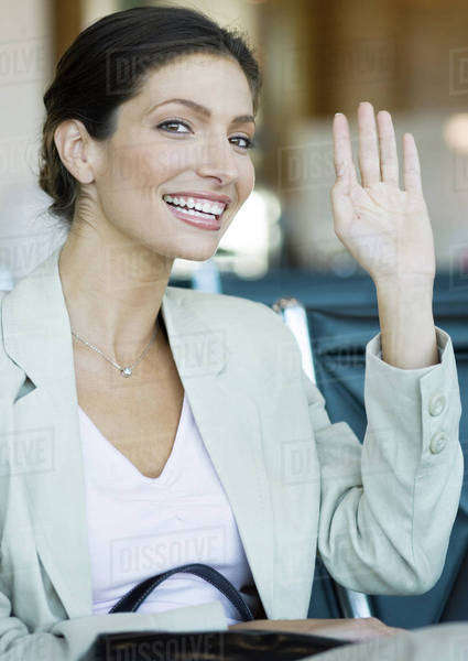 Woman waving - Royalty-free Stock Photo | Dissolve
