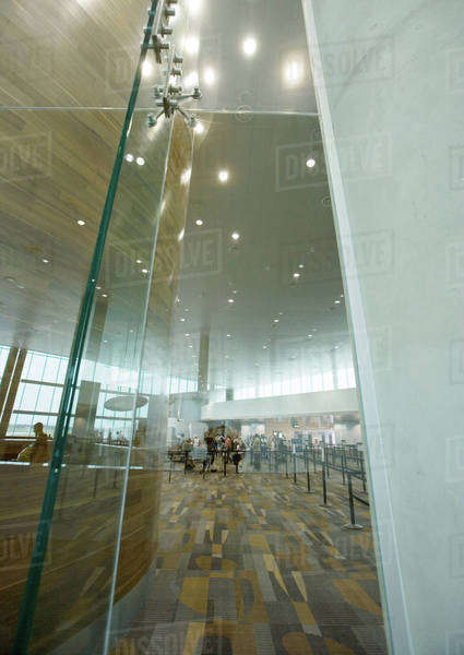 Airport interior, architectural view with security line in background ...