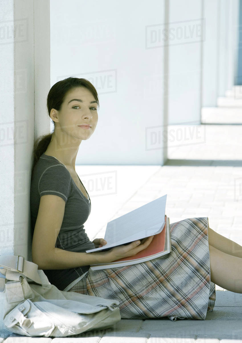 Female college student sitting on ground, studying - Royalty-free Stock ...