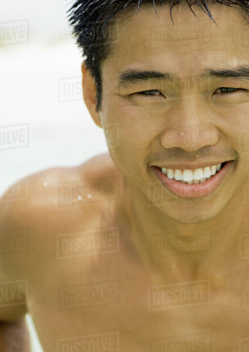 Man with wet face, smiling - Royalty-free Stock Photo | Dissolve