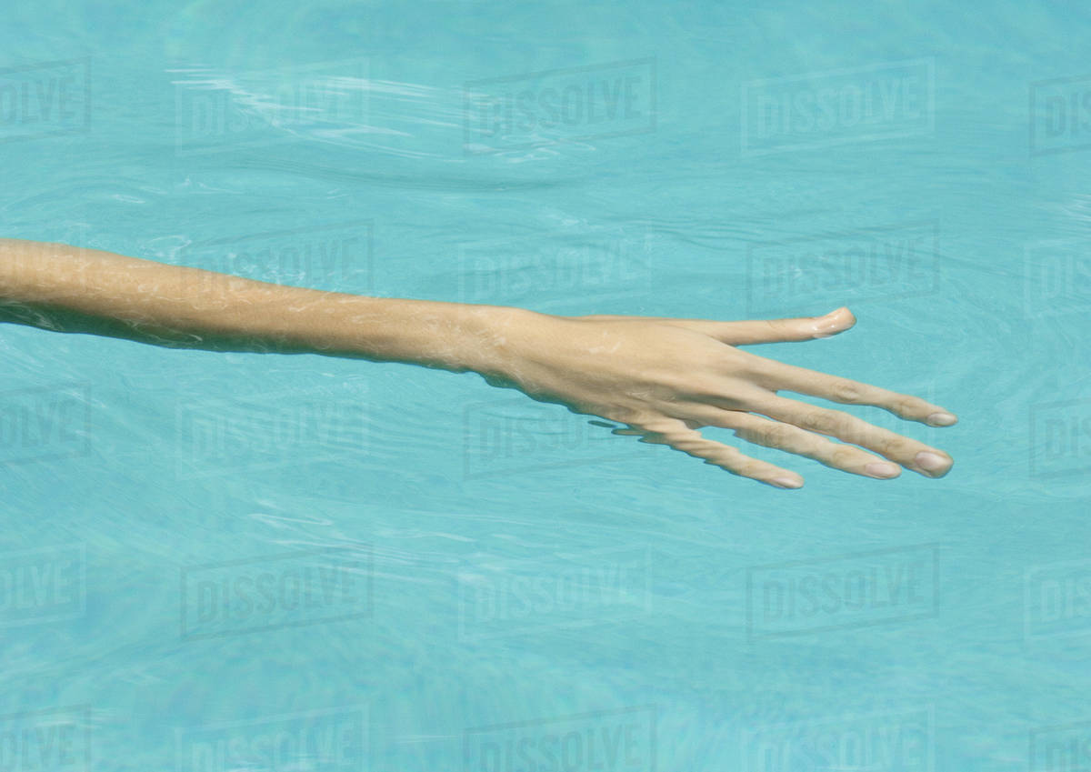 Woman's arm in water - Royalty-free Stock Photo | Dissolve