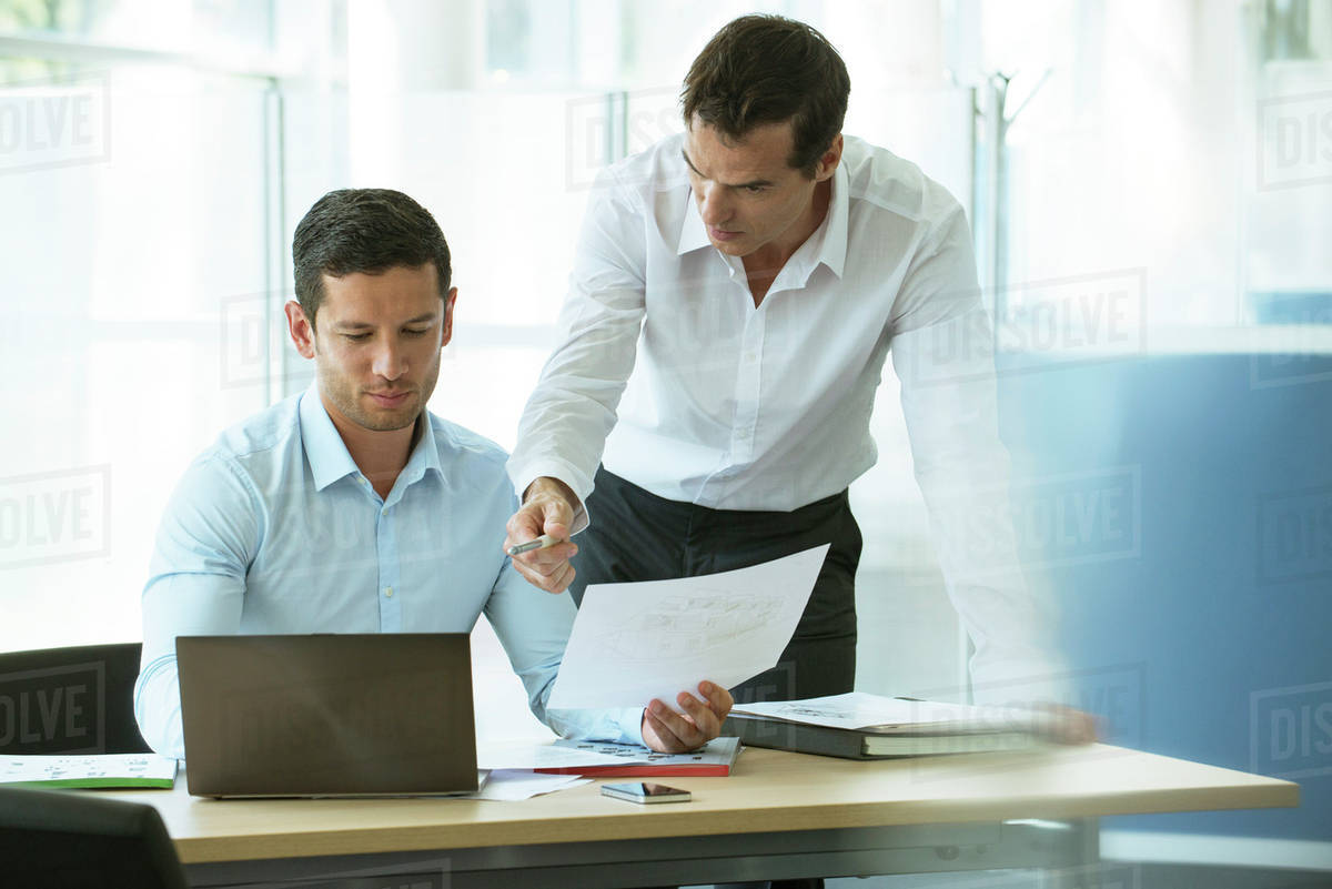 Business professionals collaborating - Royalty-free Stock Photo | Dissolve