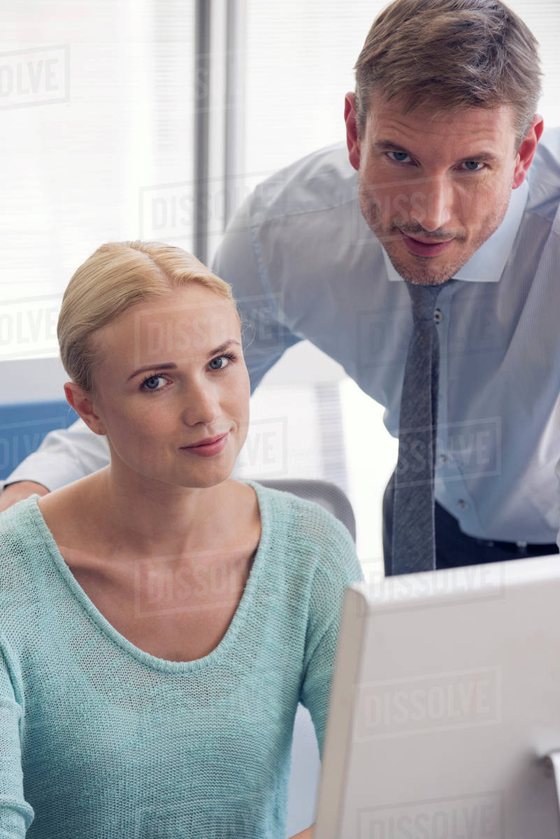 Colleagues collaborating on project, portrait - Stock Photo - Dissolve