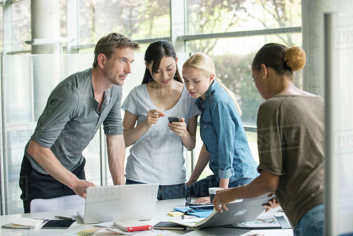 Colleagues collaborating - Stock Photo - Dissolve