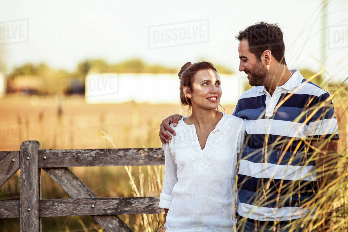 Couple on walk through countryside - Royalty-free Stock Photo | Dissolve