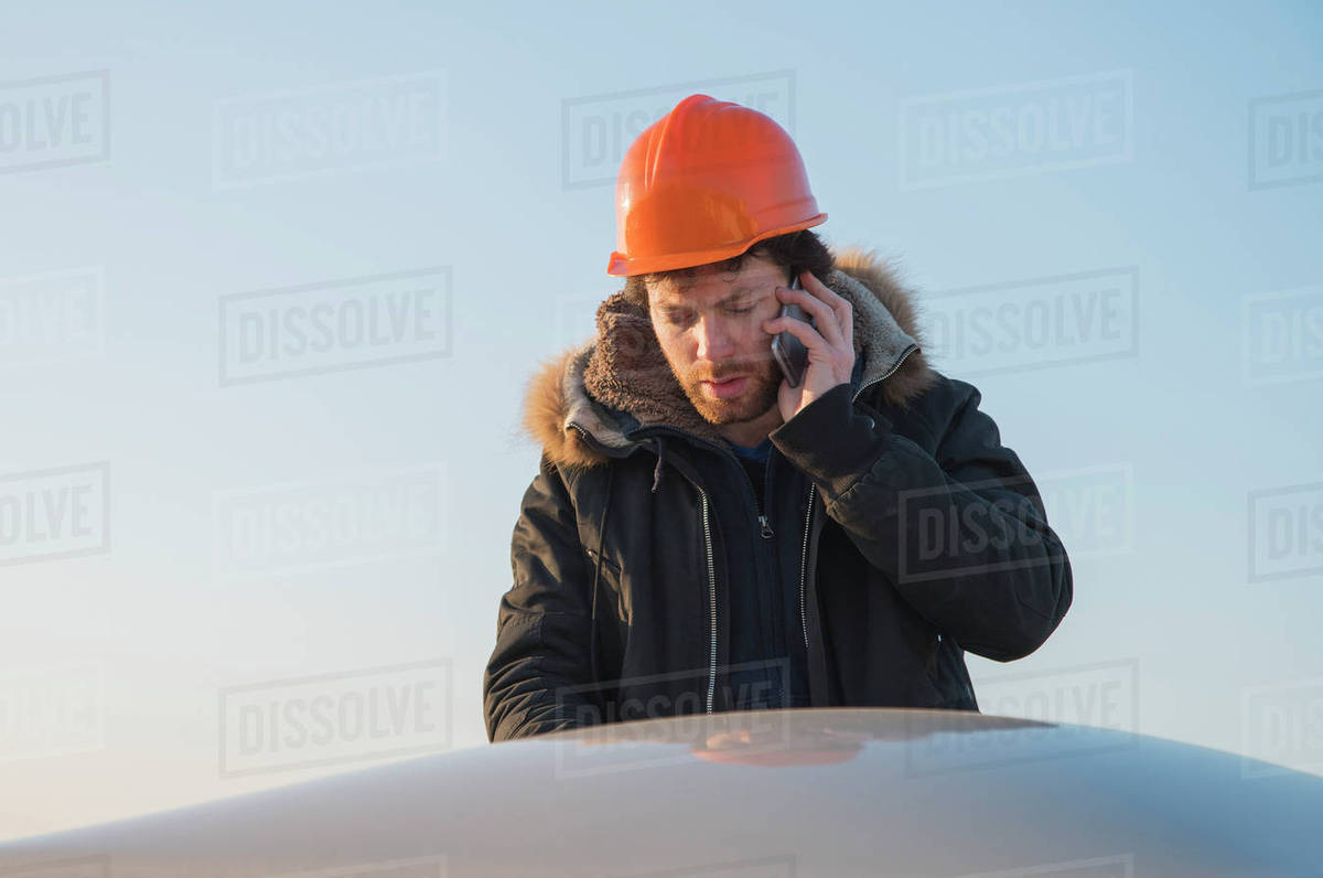 Construction worker talking on cell phone - Royalty-free Stock Photo ...