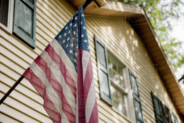 American flag on exterior of home - Royalty-free Stock Photo | Dissolve