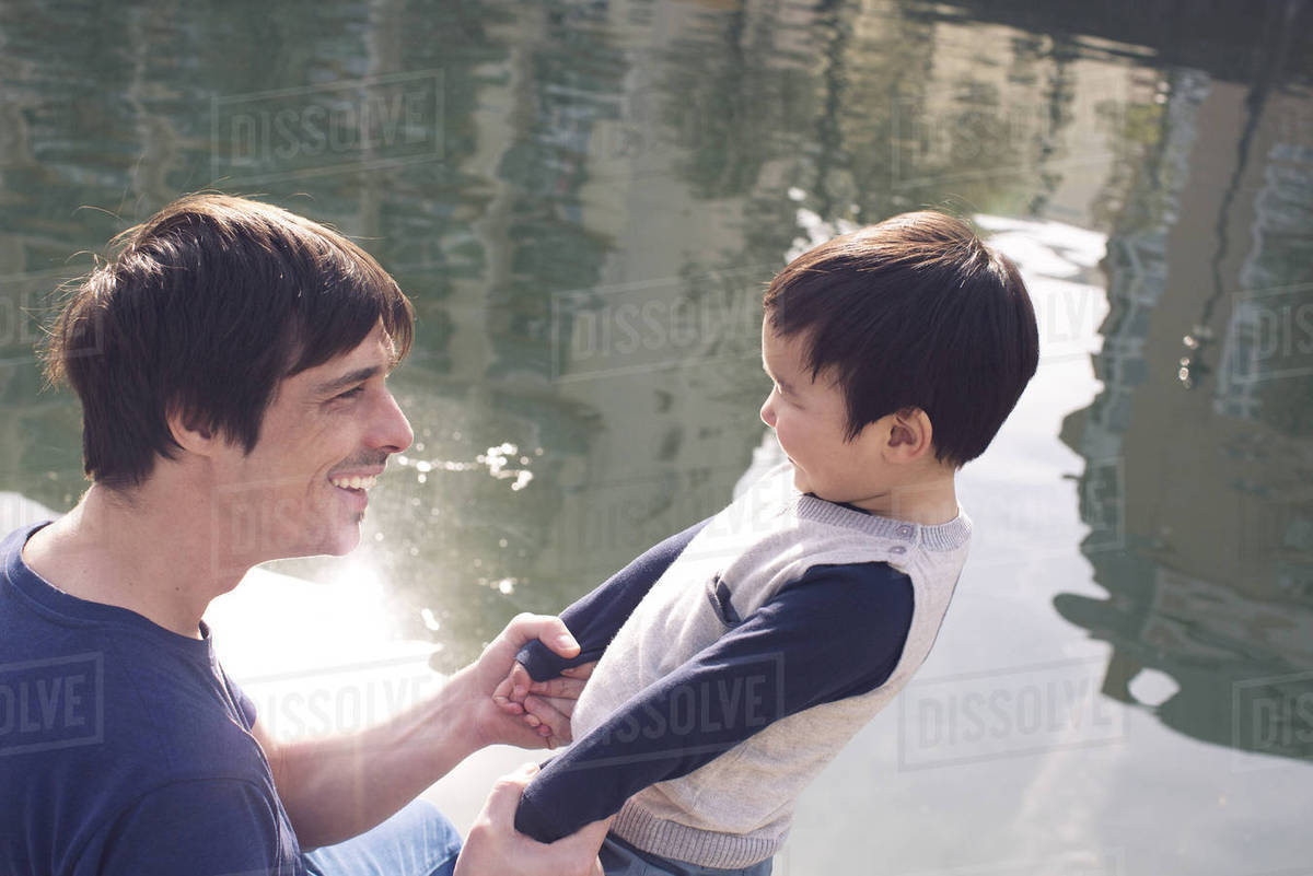 Father and little boy hanging out by river - Royalty-free Stock Photo ...