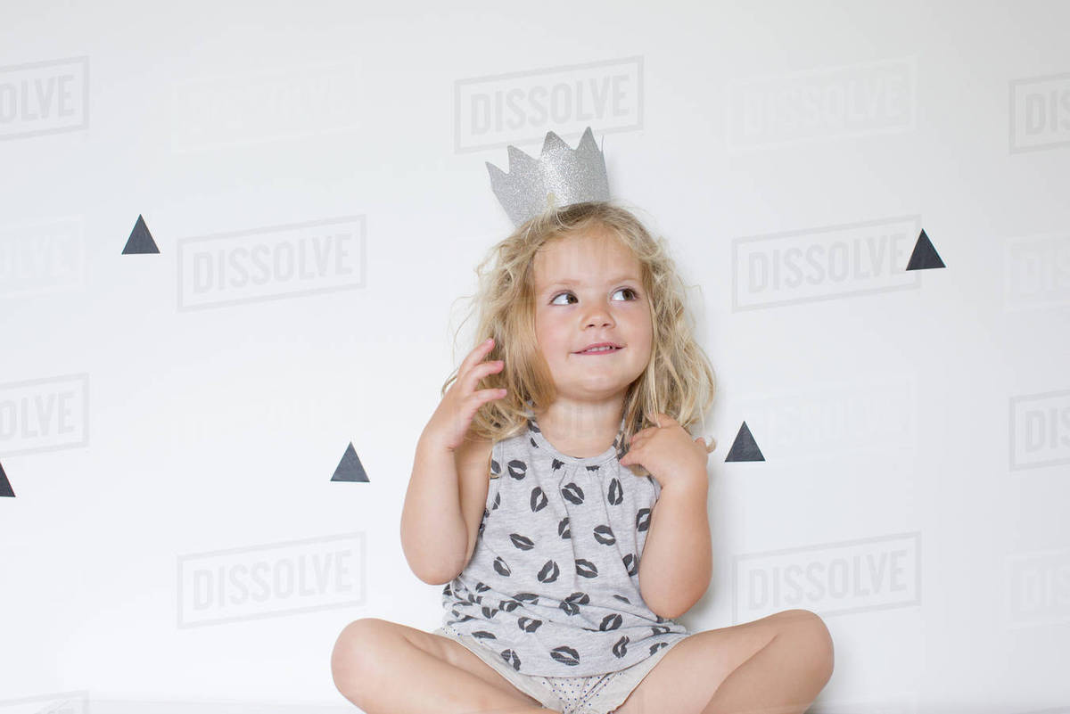 Little girl wearing paper crown - Royalty-free Stock Photo | Dissolve
