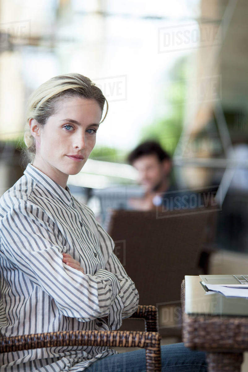 Woman with arms folded and determined look on face, portrait - Stock ...