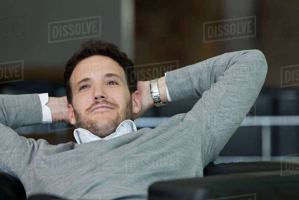 Businessman relaxing with hands behind back - Royalty-free Stock Photo ...