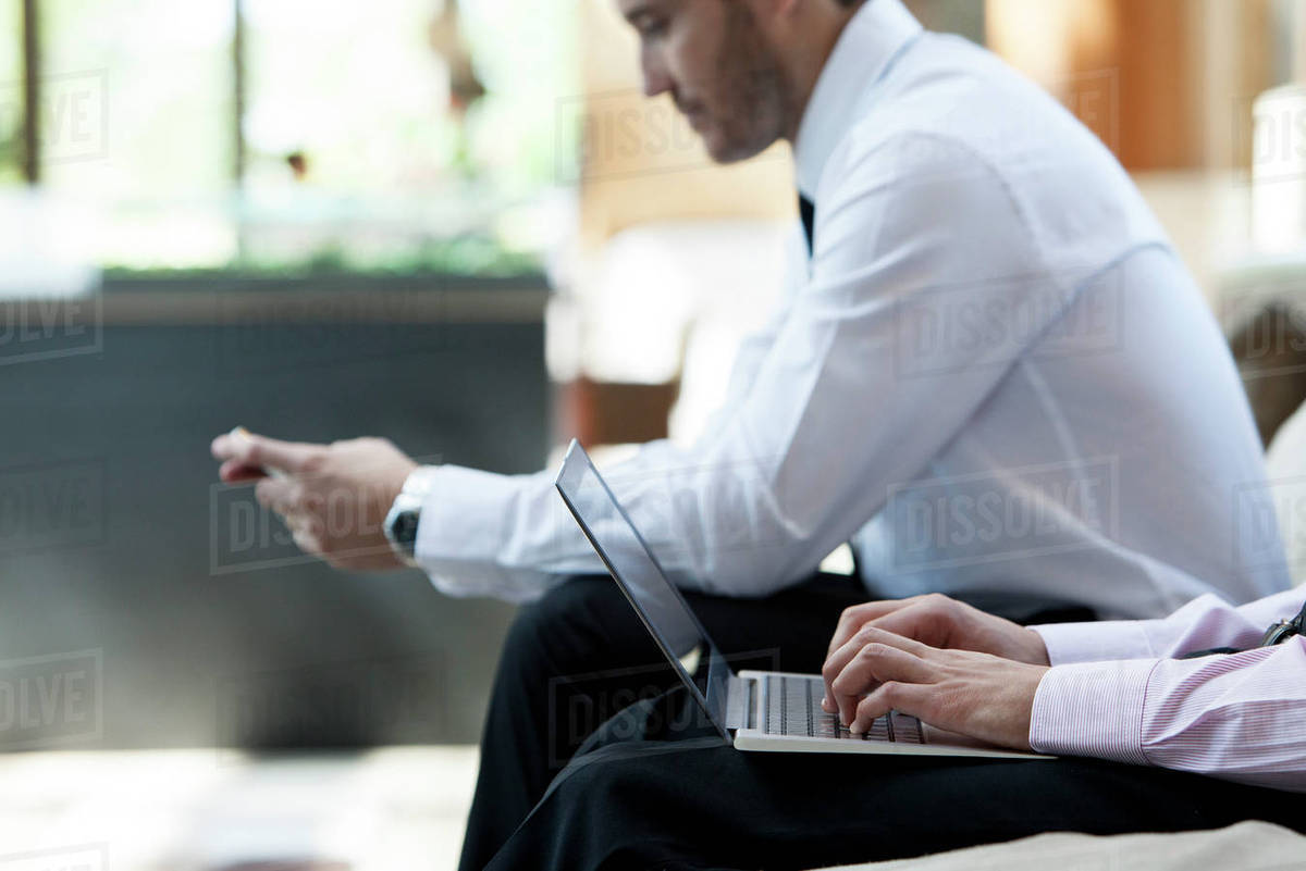 Business professionals using wireless devices - Royalty-free Stock ...