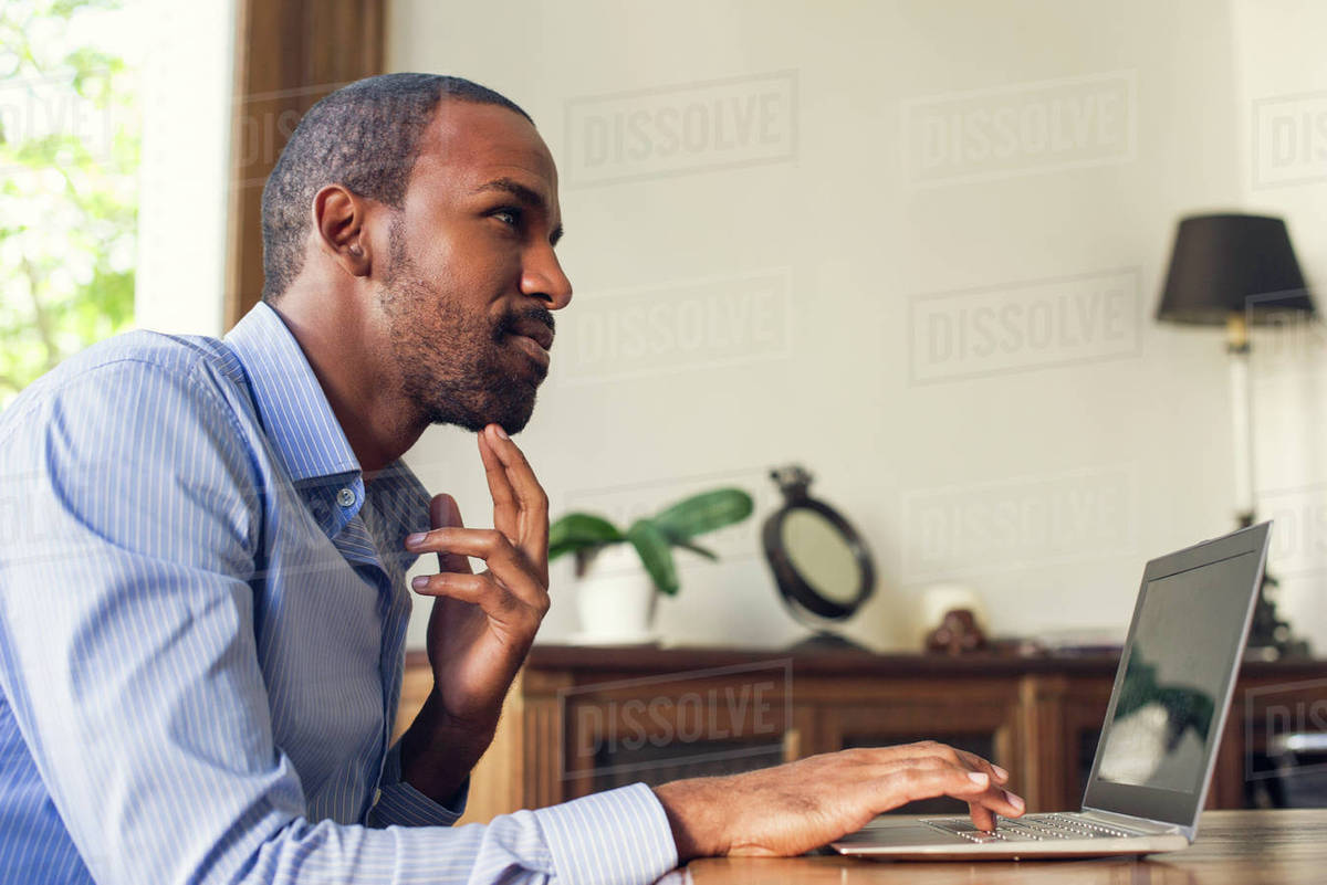 Man using laptop computer for online investment opportunities - Stock ...
