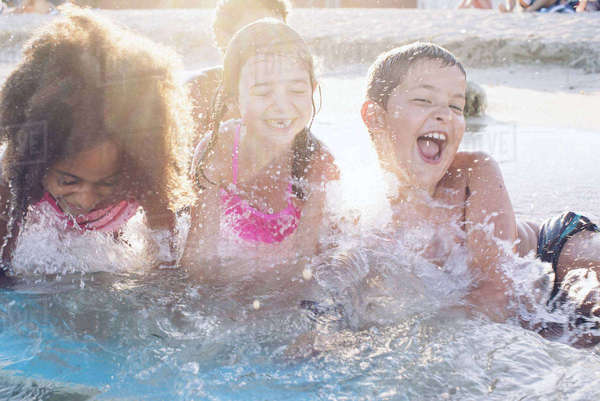 Two preteen girls dancing on beach - Stock Photo - Dissolve